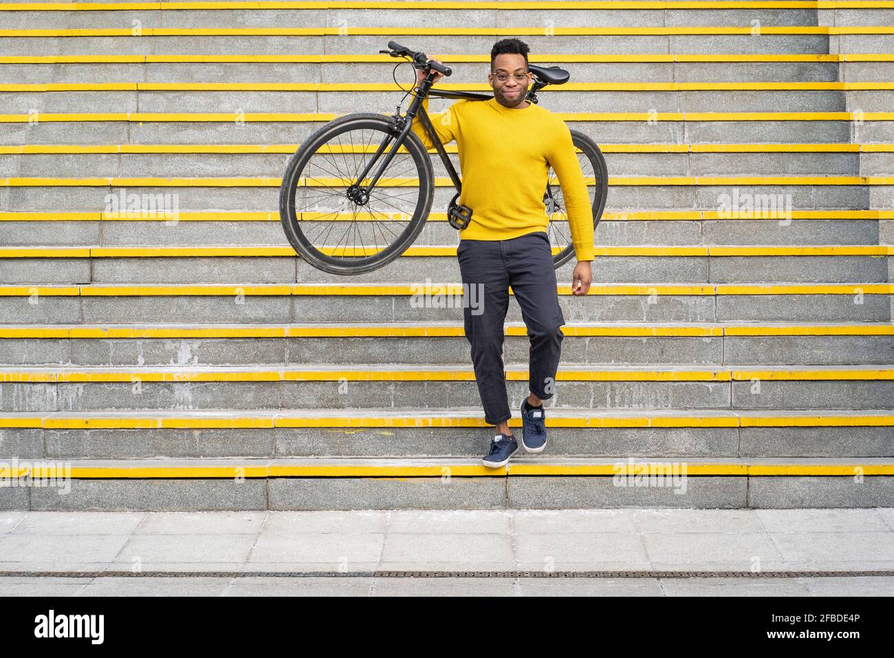 Man moving down on staircase hi-res stock photography and images - Alamy
