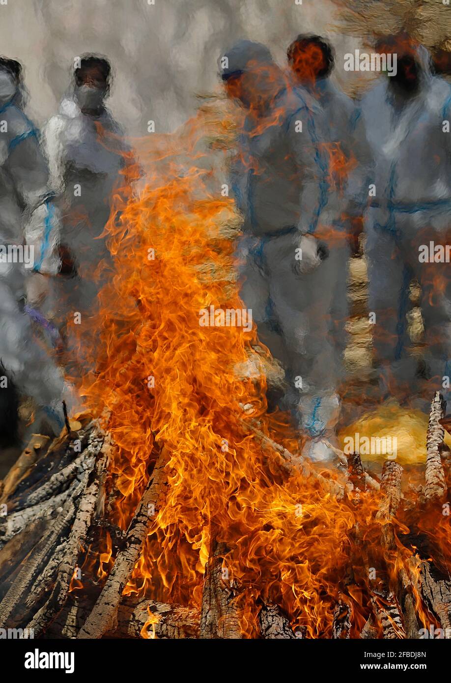 Delhi, India. 23rd Apr, 2021. A burning pyre of a Covid-19 deceased ...