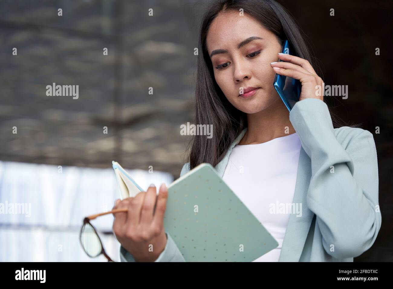 Beautiful businesswoman talking mixed race hi-res stock photography and ...