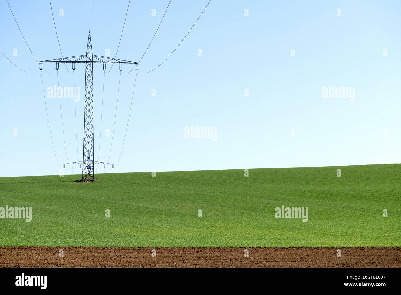 green electricity, green power, Power poles and lines across fields ...