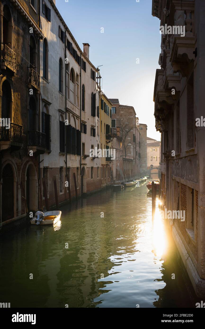 Italy, Veneto, Venice, Old houses along narrow city canal at dusk Stock ...