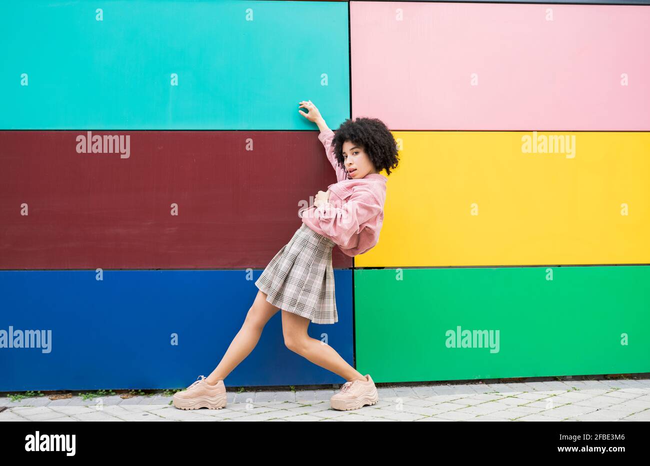 Female dancer staring while bending over backwards on footpath Stock ...