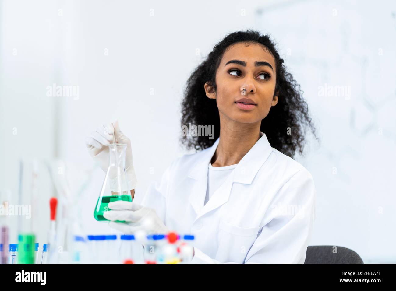 Female doctor in coat holding hi-res stock photography and images - Alamy
