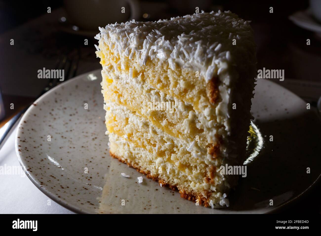 Delicious sweet piece of coconut cake with biscuit cakes Stock Photo ...