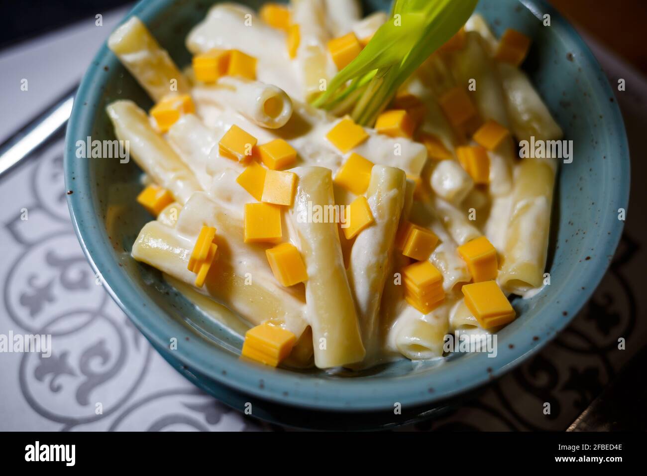 Delicious fresh hard pasta with cheese and herbs Stock Photo - Alamy