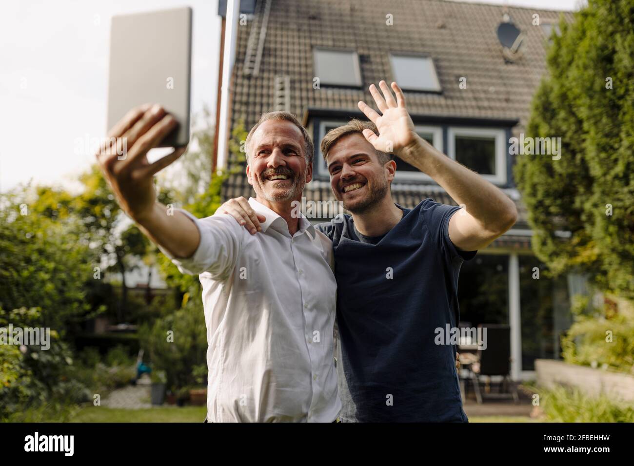 Father waving to son hi-res stock photography and images - Alamy
