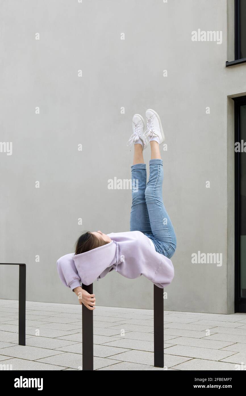 Woman lying on back legs up hi-res stock photography and images - Alamy