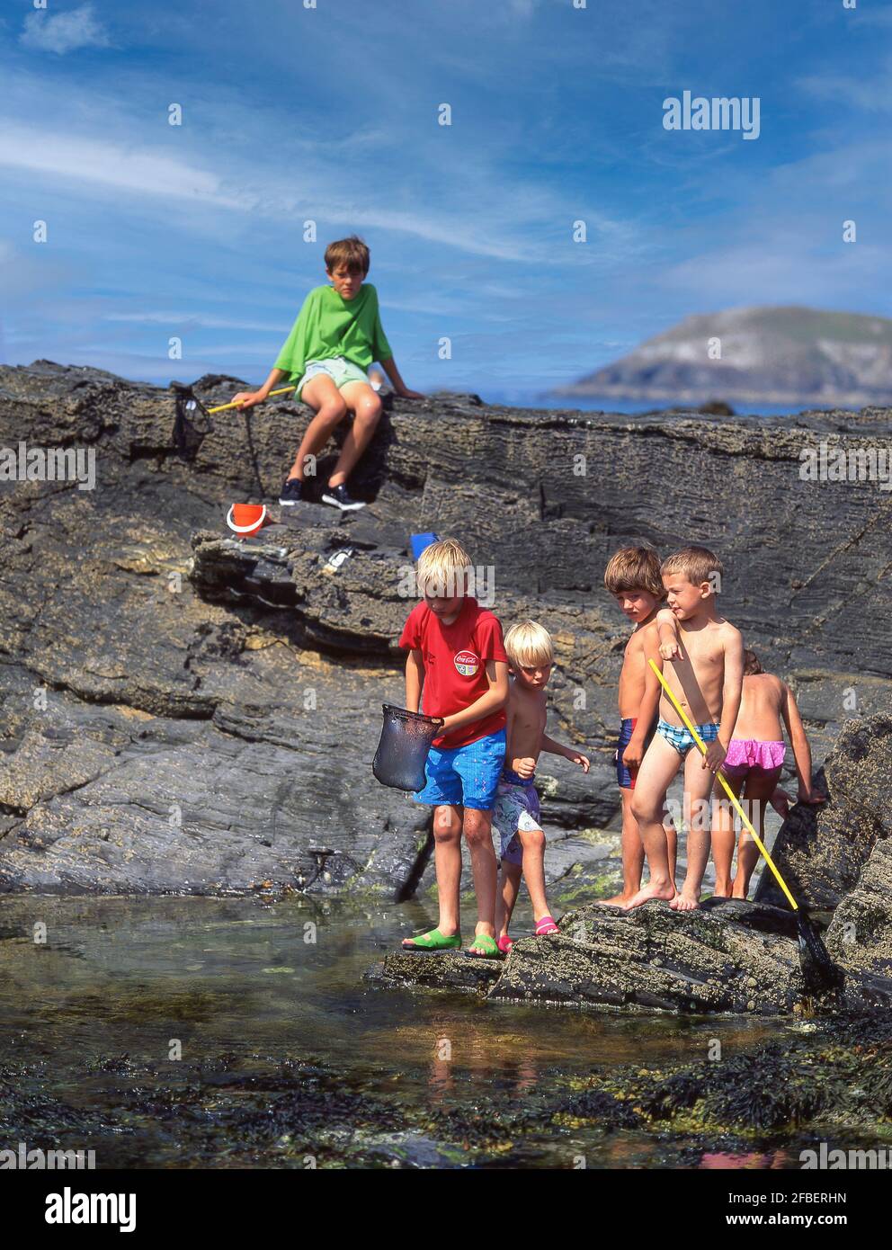 Kids fishing nets on beach hi-res stock photography and images - Alamy