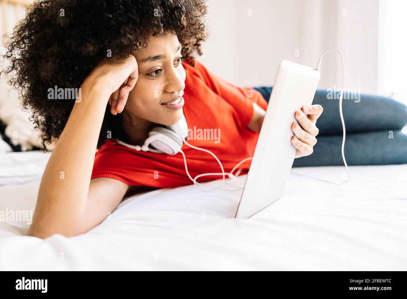 Young beautiful women looking tablet hi-res stock photography and ...