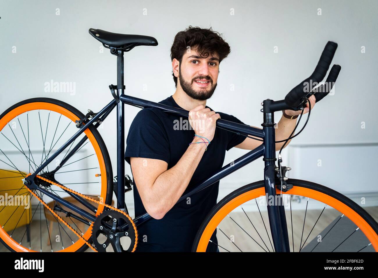 Man carrying bicycle travel hi-res stock photography and images - Alamy