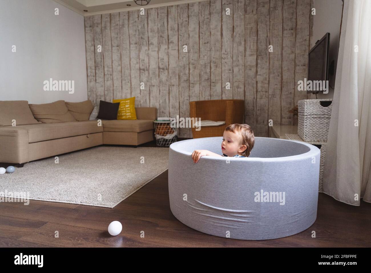 Boy in plastic balls hi-res stock photography and images - Alamy