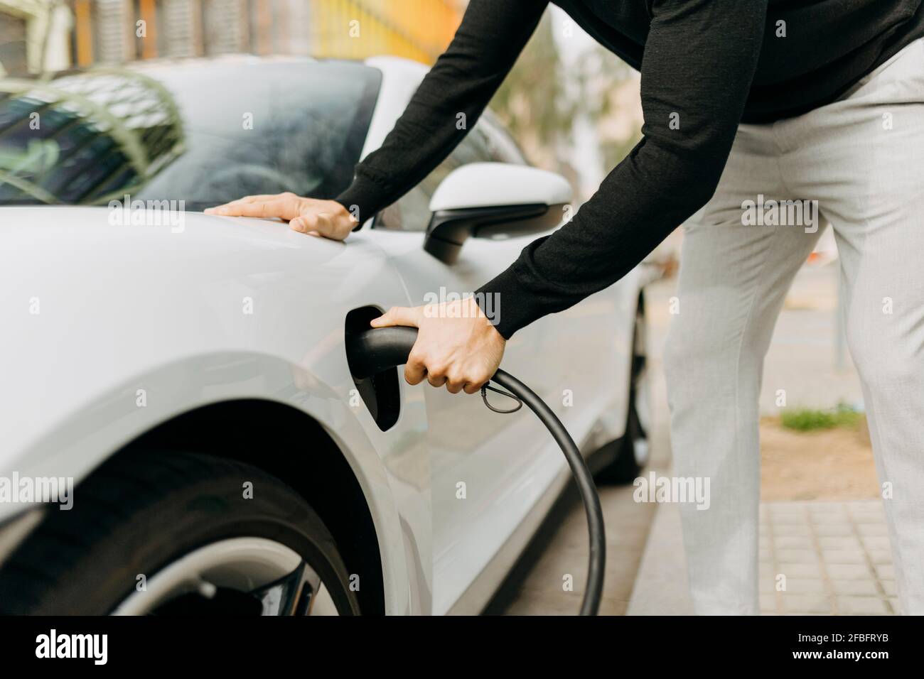 Man plugging in power hi-res stock photography and images - Alamy