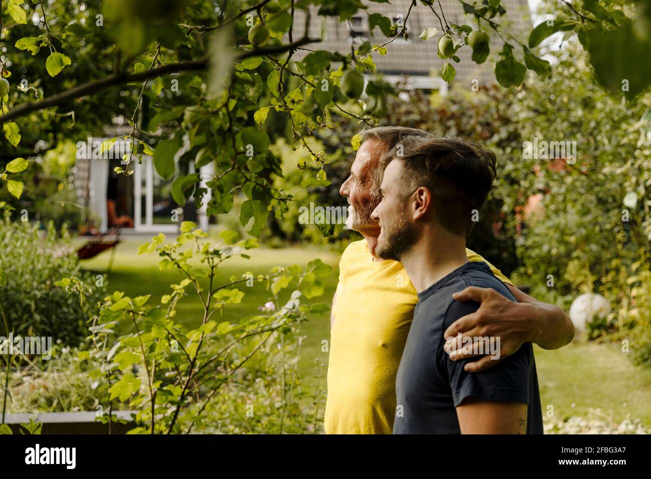 Father son standing side by side hi-res stock photography and images ...