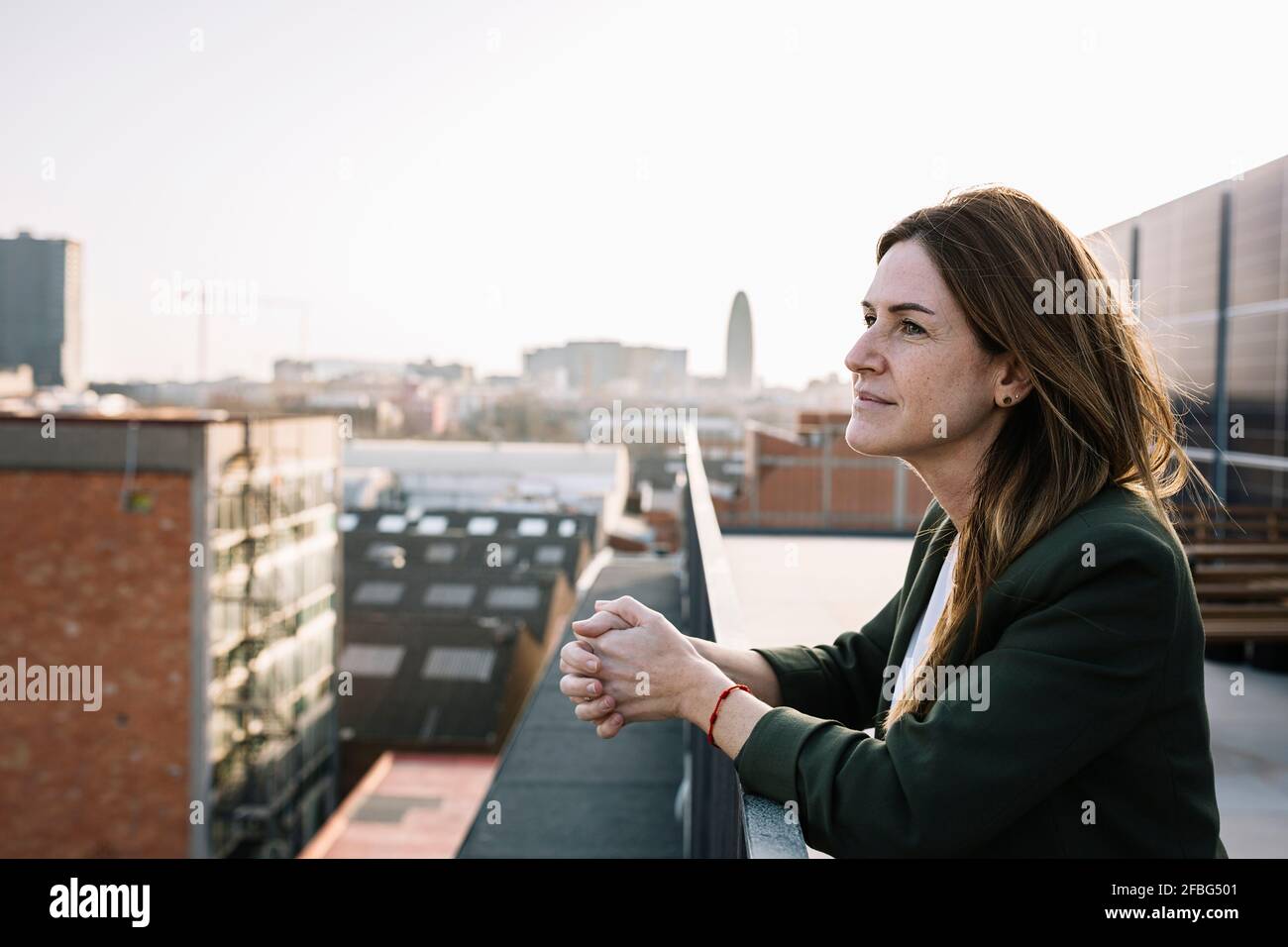 Woman railing rooftop terrace hi-res stock photography and images - Alamy