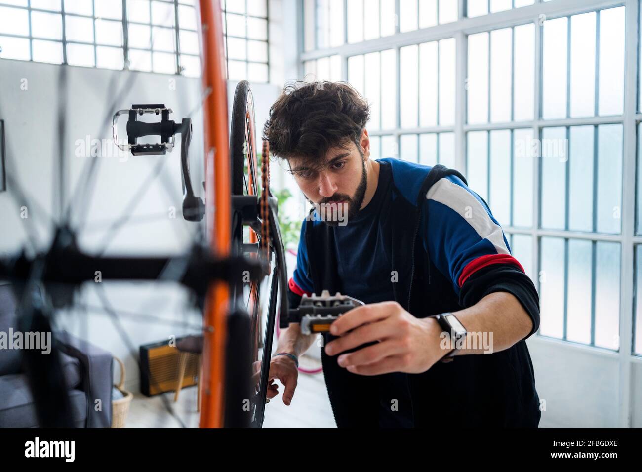 Man holding bike wheel hi-res stock photography and images - Alamy