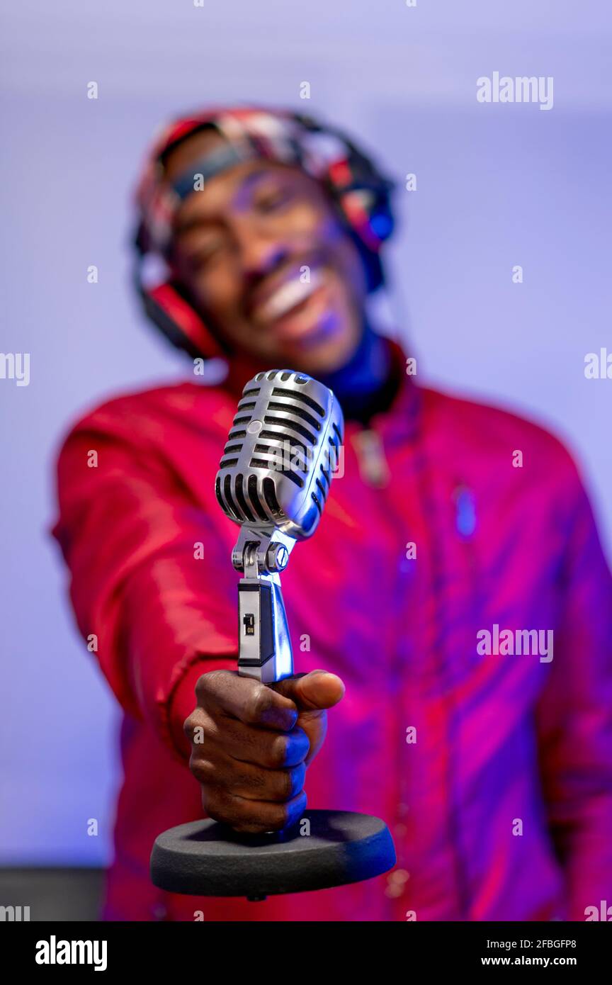 Person Singing Into Microphone