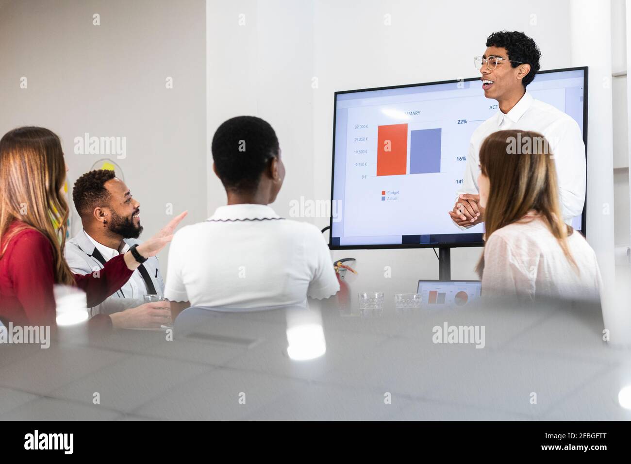 Team having discussion while working in meeting at office Stock Photo ...
