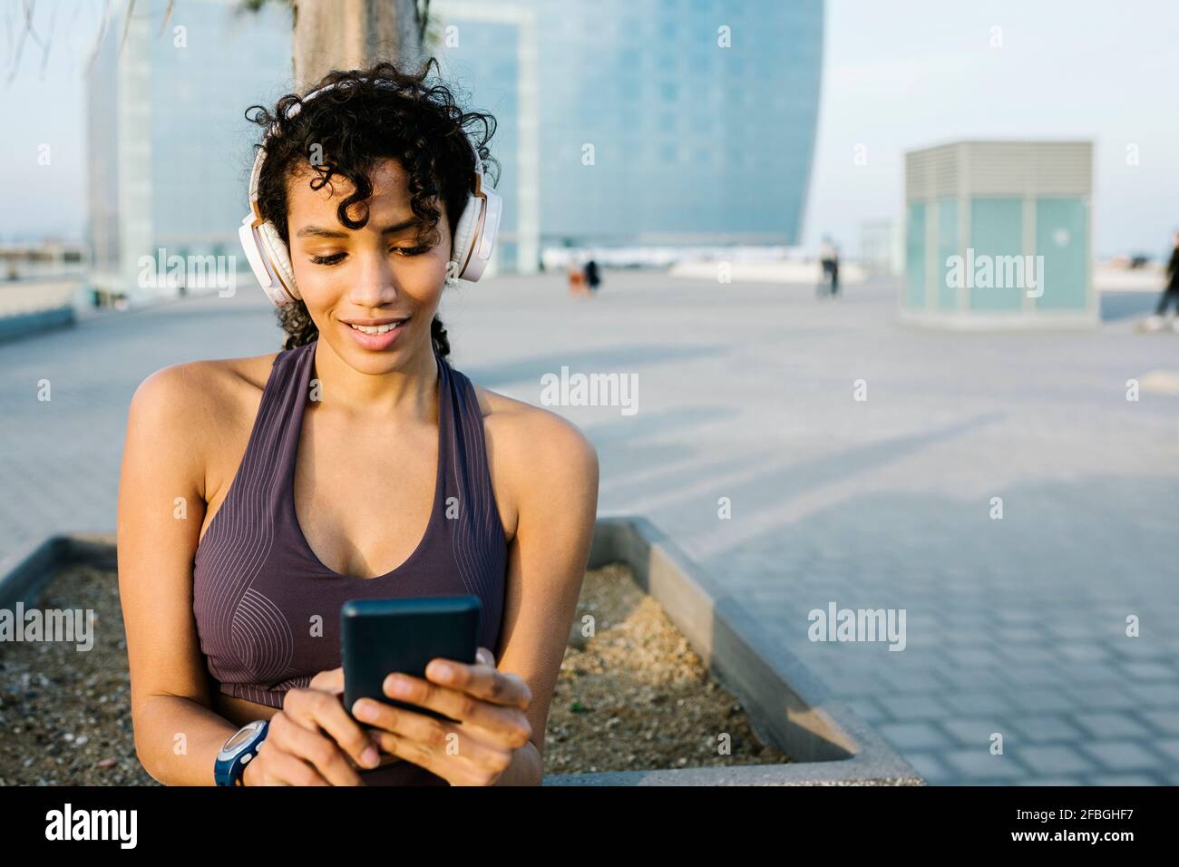 Athlete using wireless headphone hi-res stock photography and images ...