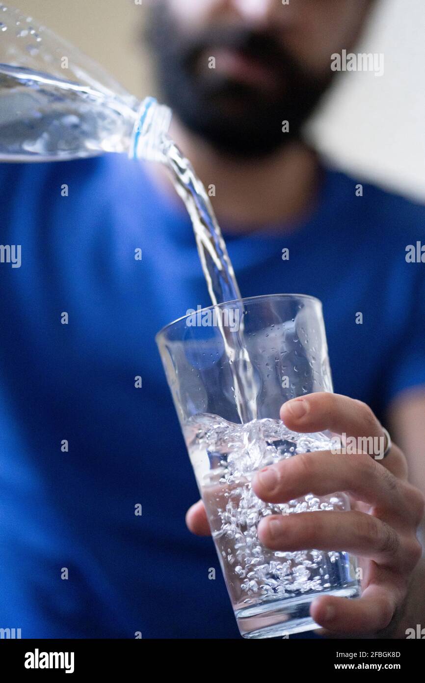 Close up man pouring water hi-res stock photography and images - Alamy