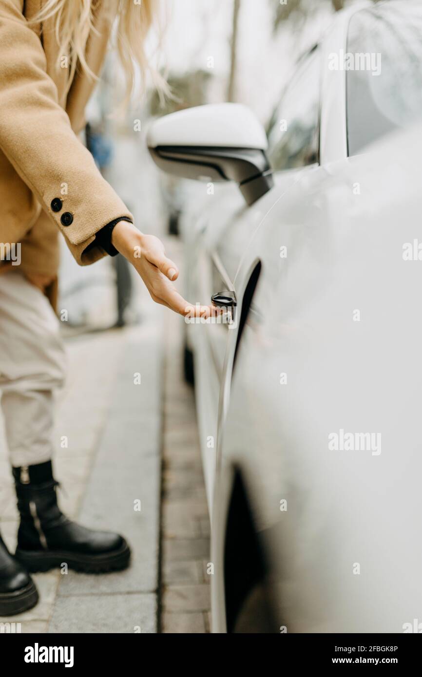 Opening car door woman hi-res stock photography and images - Alamy