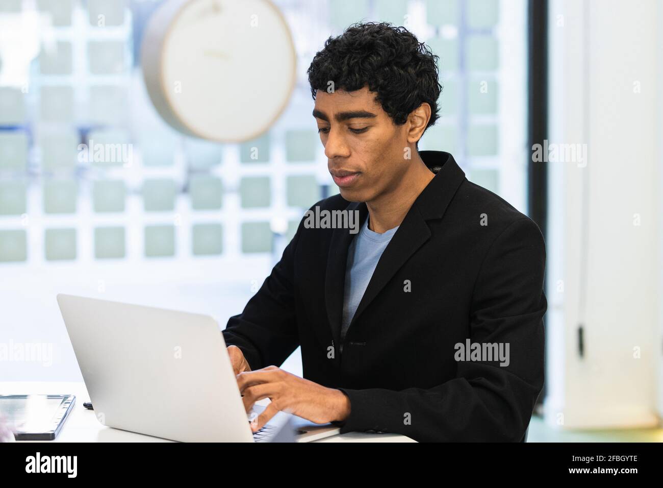 Young man working office laptop hi-res stock photography and images - Alamy
