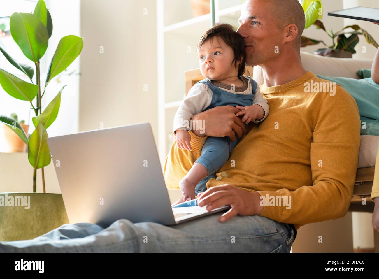 Father laptop kissing baby hi-res stock photography and images - Alamy