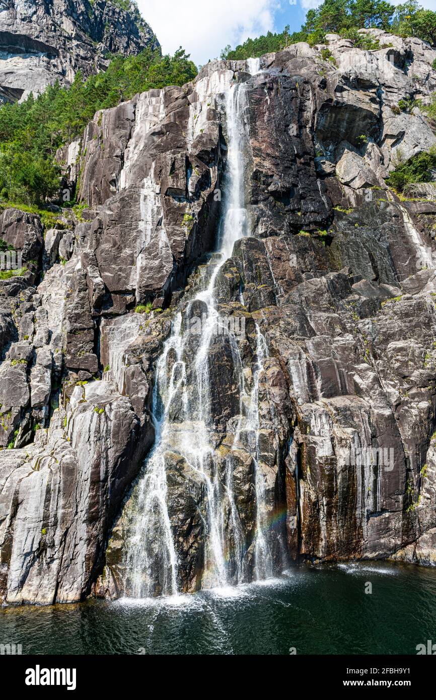Small waterfall splashing down steep cliff in Lysefjord Stock Photo - Alamy
