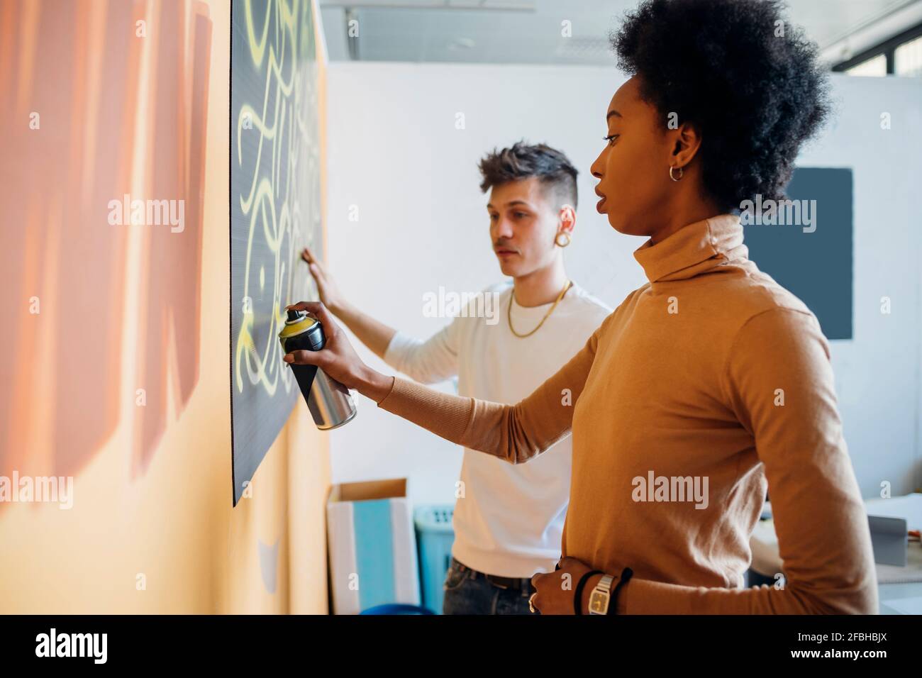 Woman Spray Paint High Resolution Stock Photography and Images - Alamy