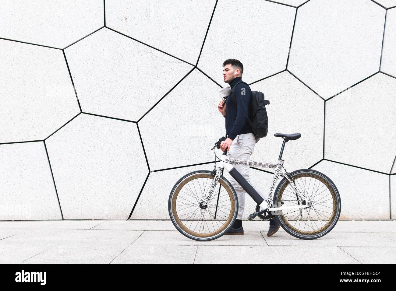 Man wheeling bike hi-res stock photography and images - Alamy