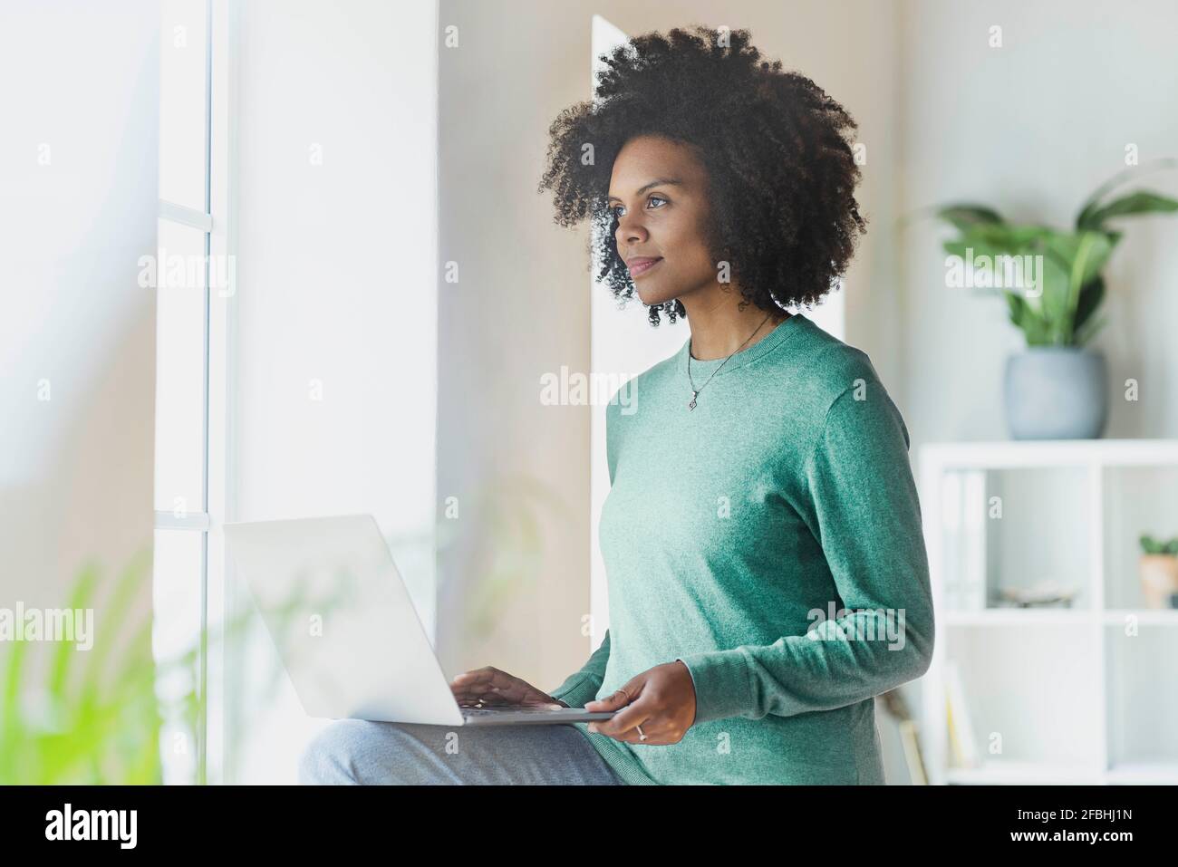 Laptop on lap black hi-res stock photography and images - Alamy