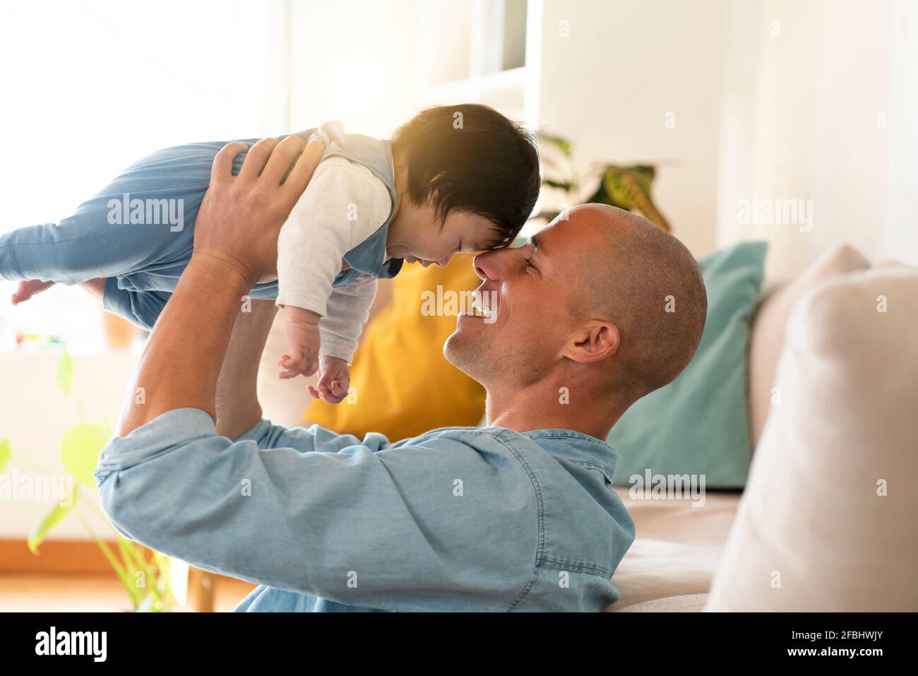 Child picking up room hi-res stock photography and images - Alamy