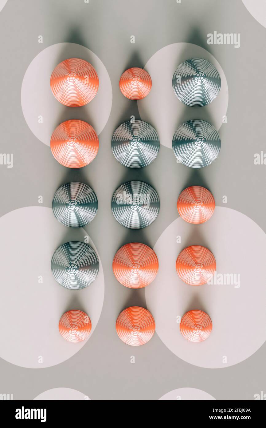 Three dimensional render of red and gray cones laid on polka dot ...