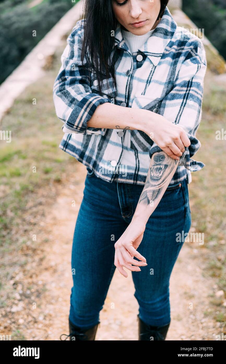 Person rolling sleeves women hi-res stock photography and images - Alamy
