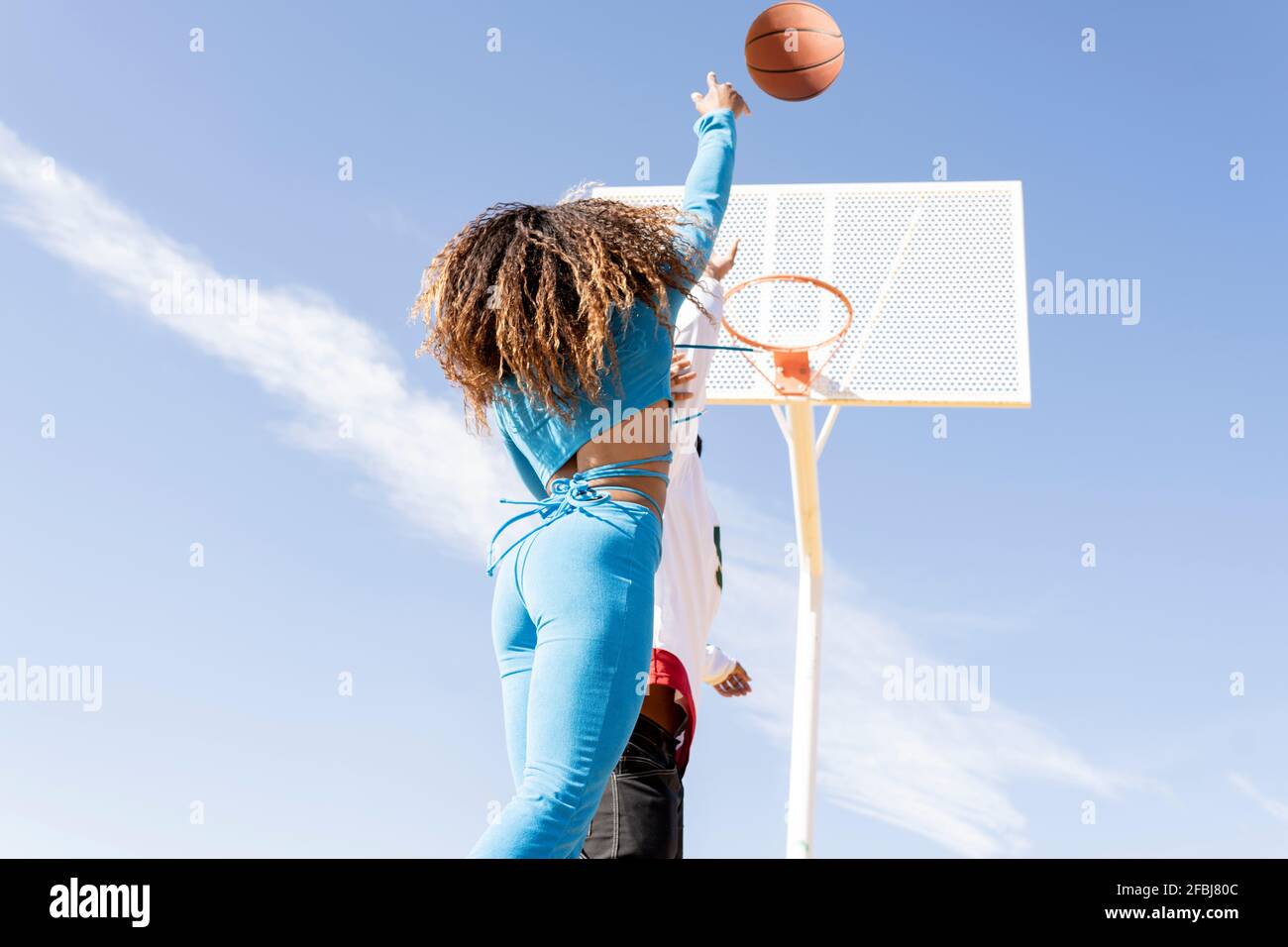 Female shooting basketball hi-res stock photography and images - Alamy