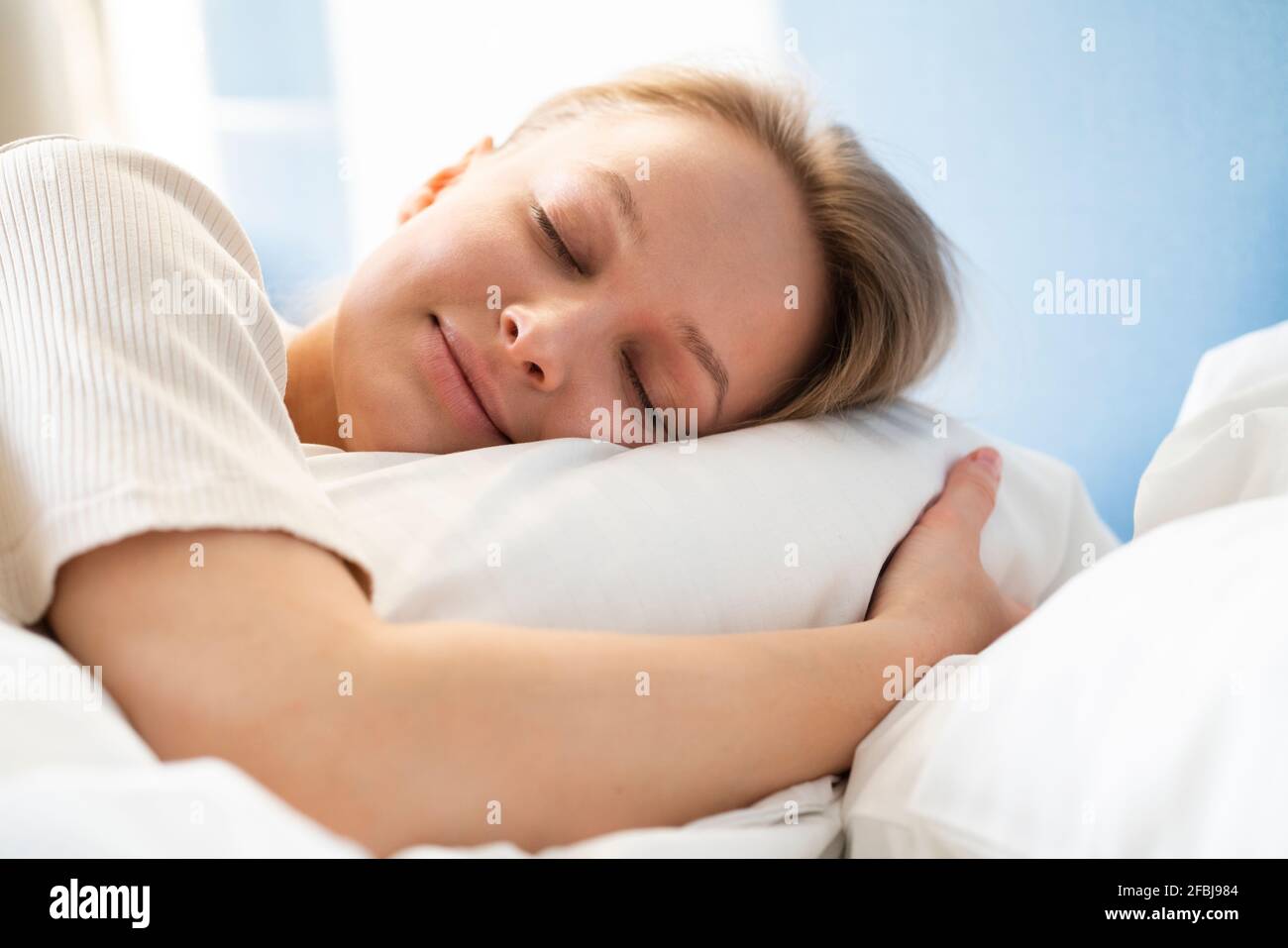 Young woman sleeping at home Stock Photo - Alamy