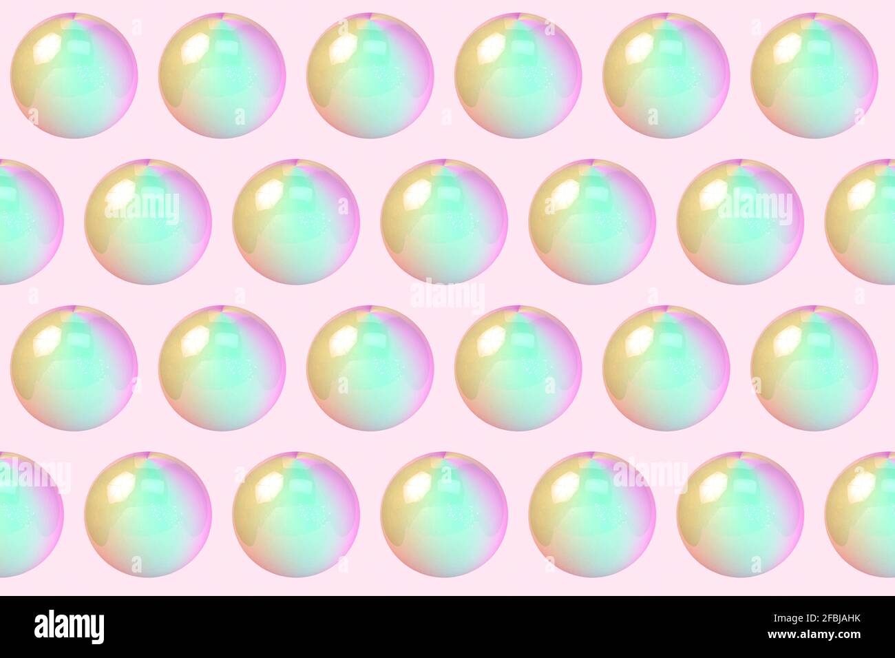 Three dimensional pattern of rows of bubbles against pink background ...