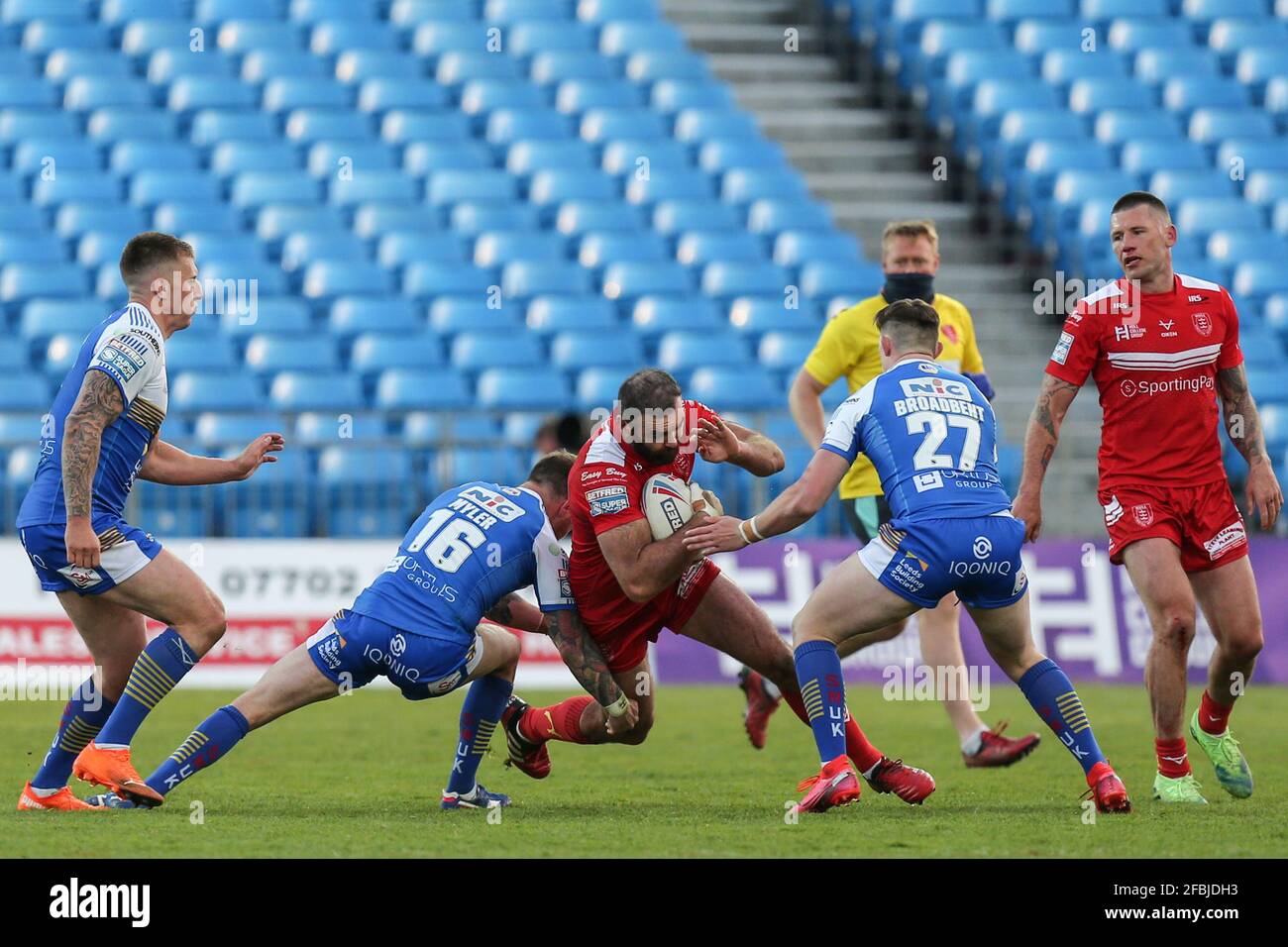 Kane Linnett (12) of Hull KR runs at the Leeds defence Stock Photo - Alamy
