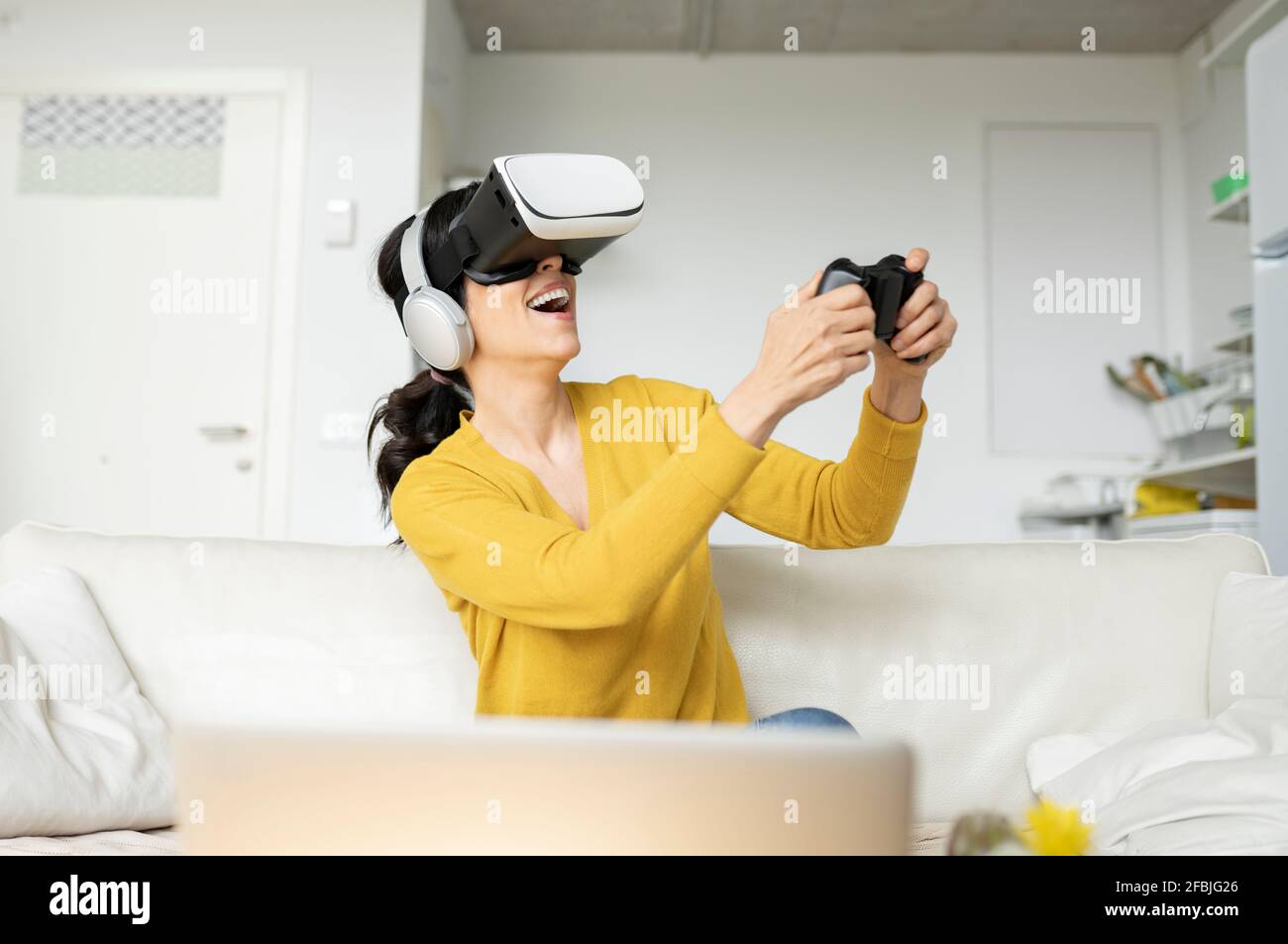 Wearing headset holding game hi-res stock photography and images - Alamy