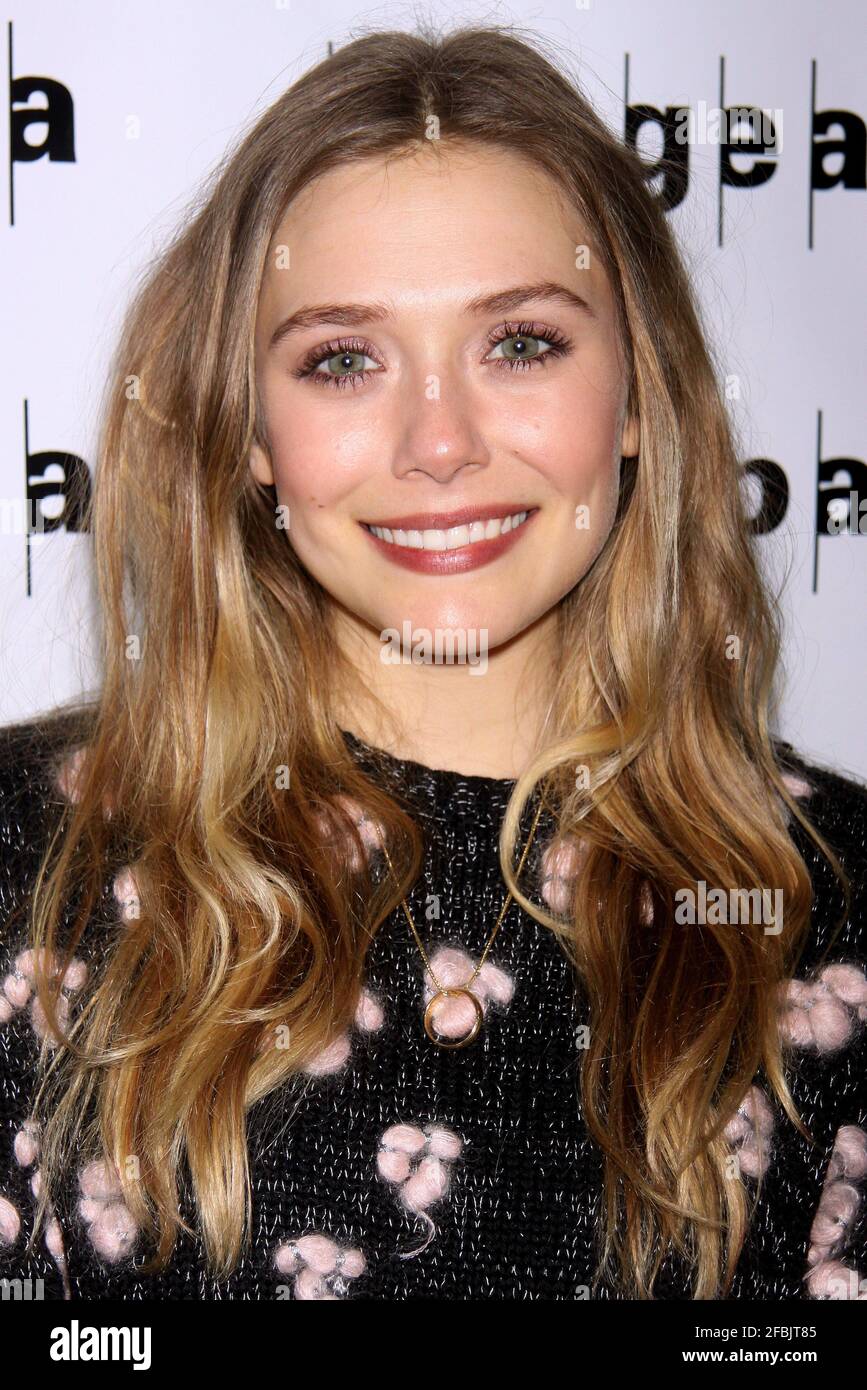 NEW YORK, NY- OCTOBER 16: Elizabeth Olsen arrives for the opening party ...