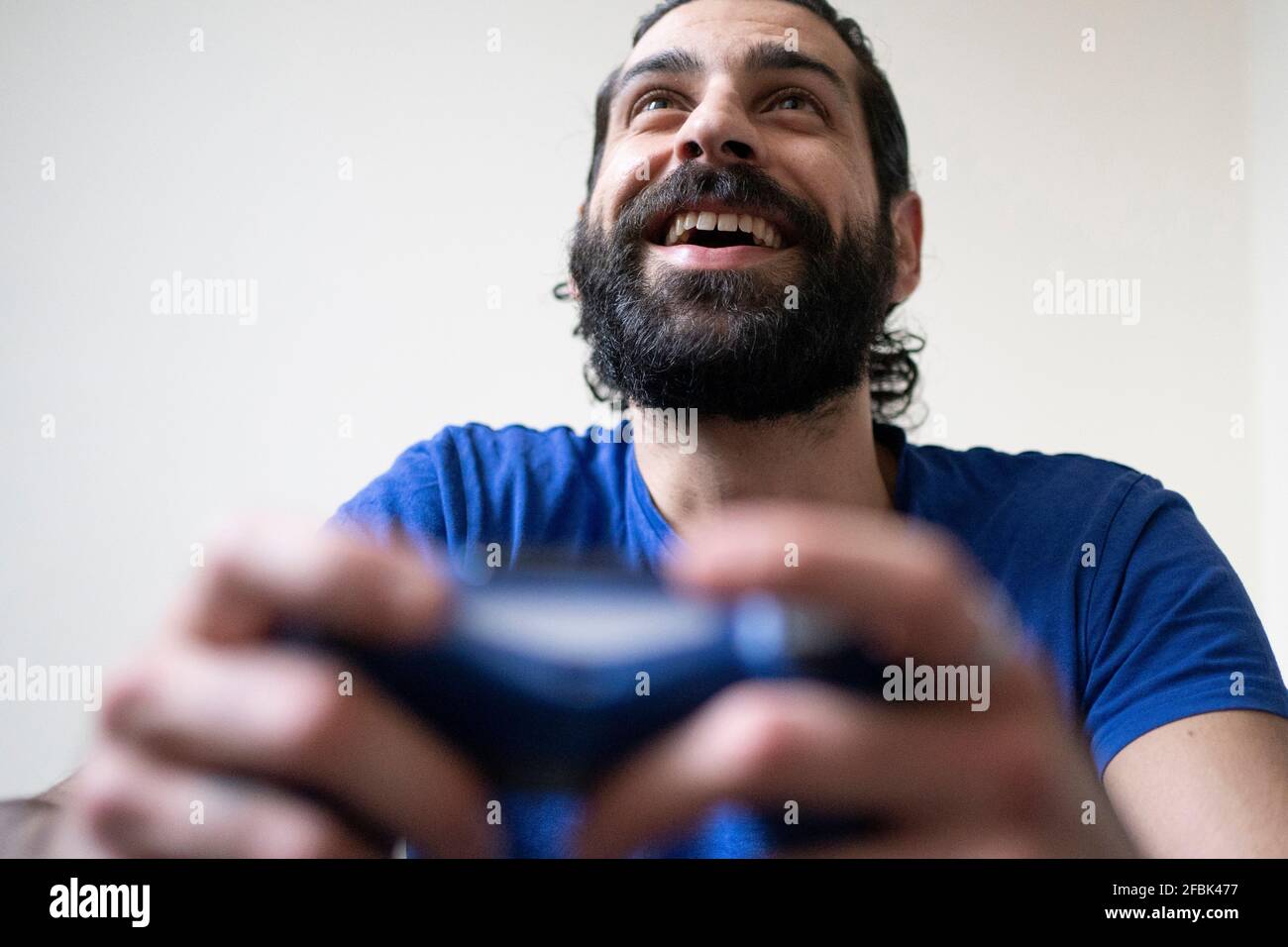 Excited man playing video game Stock Photo - Alamy Excited man playing video game Stock Photo - Alamy