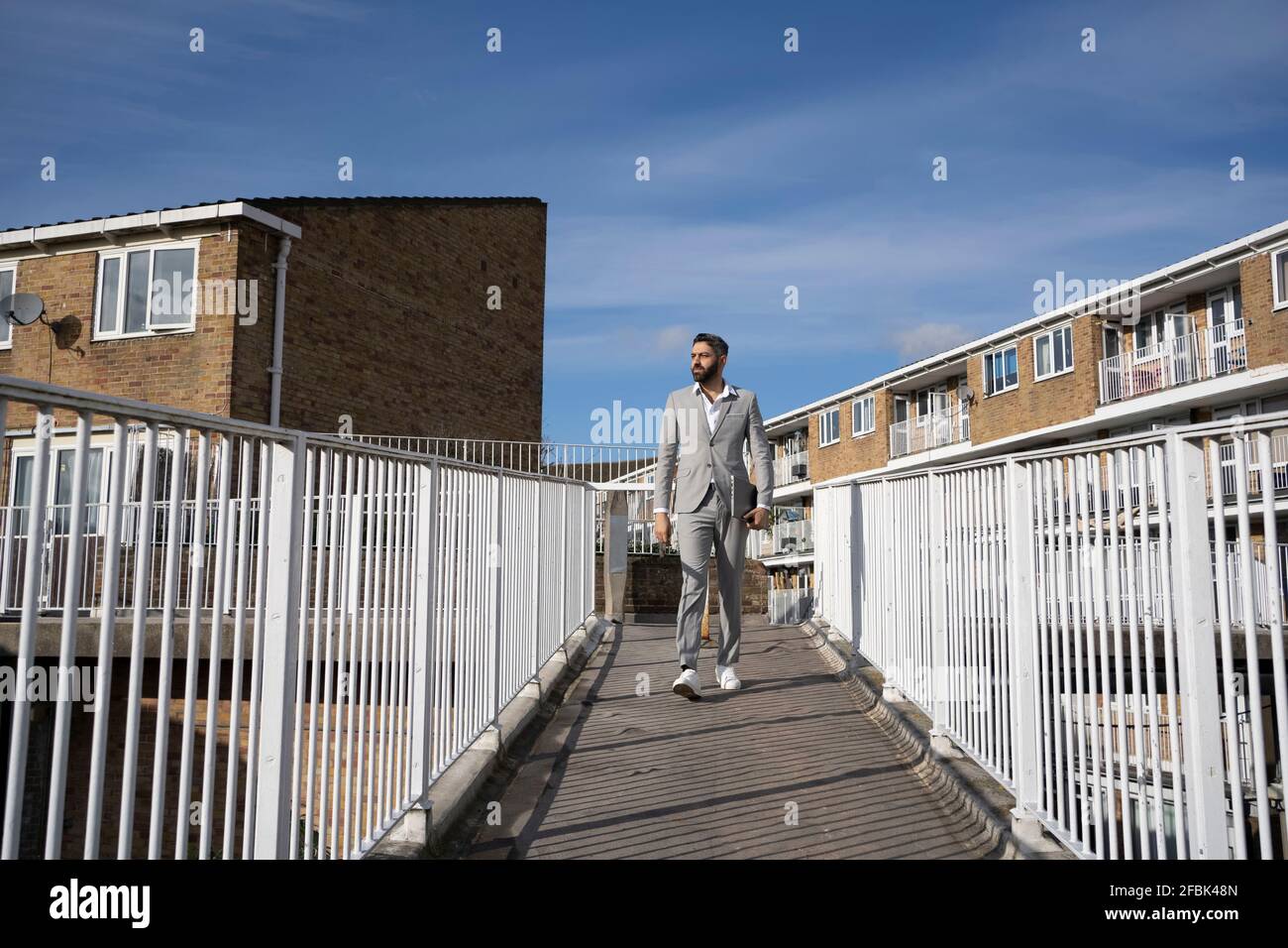 Professional man walking laptop computer hi-res stock photography and ...