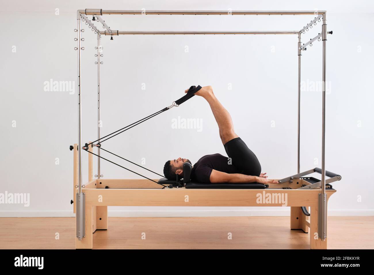 Man reformer pilates hi-res stock photography and images - Alamy