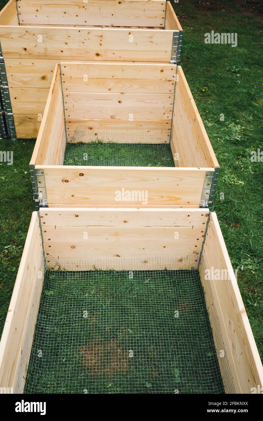 Wooden crates on grass at garden Stock Photo - Alamy