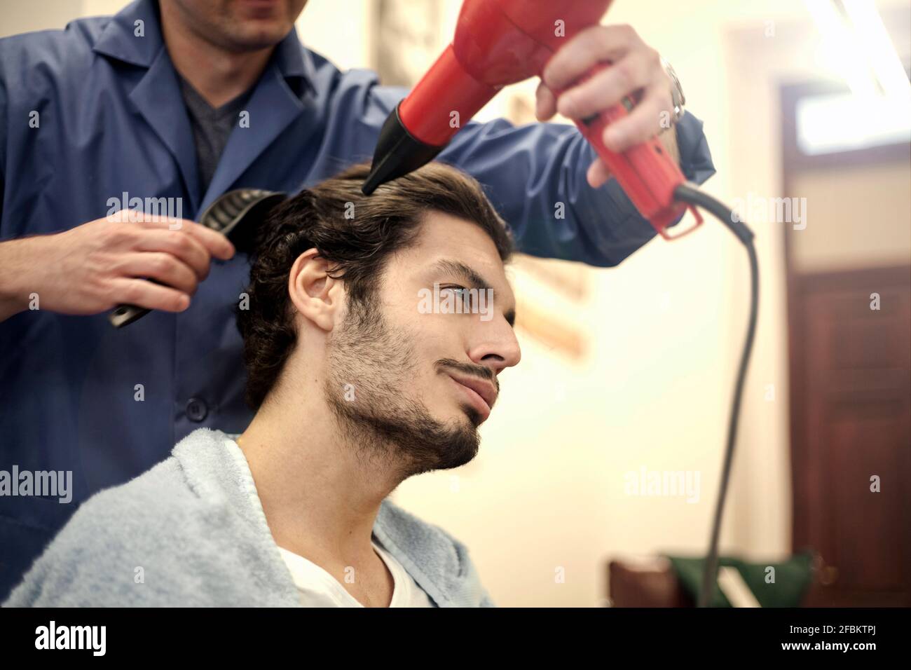 Man drying hair hi-res stock photography and images - Alamy