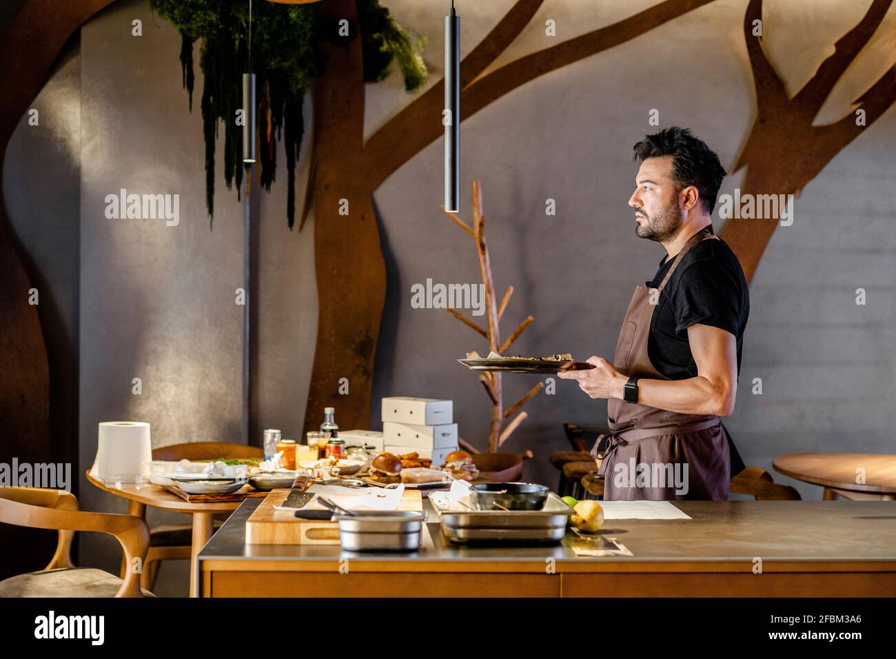 Holding food plate hi-res stock photography and images - Alamy