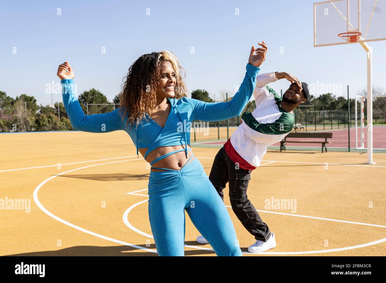 Smiling man dancing raising arms hi-res stock photography and images ...