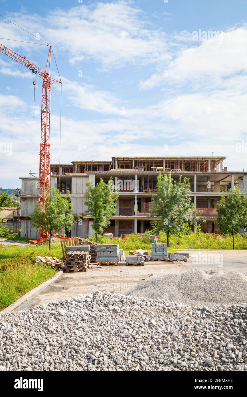 Construction site with crane and unfinished building Stock Photo - Alamy