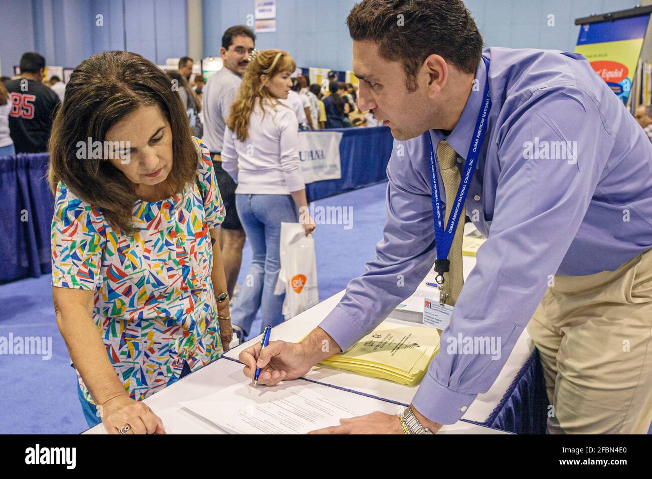 Survey interview interviewing completing questionnaire man woman hi-res ...