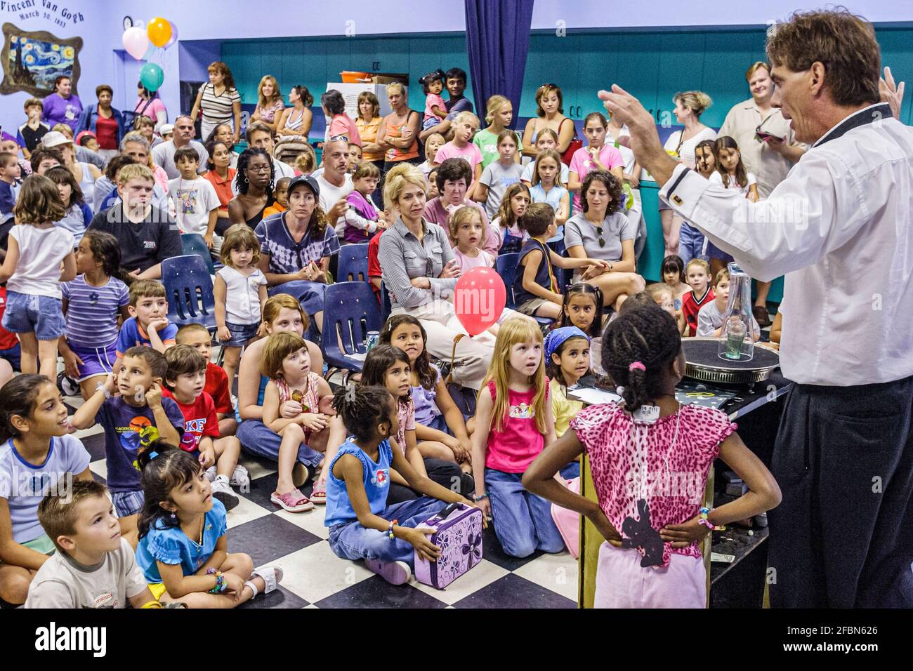 Audience boys girls magician do trick hi-res stock photography and ...