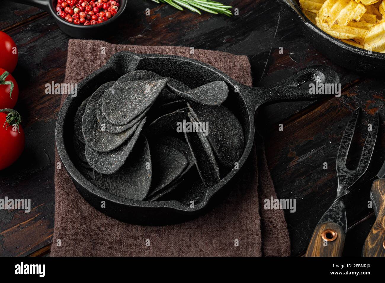 Black crispy potato chips set, on old dark wooden table Stock Photo - Alamy